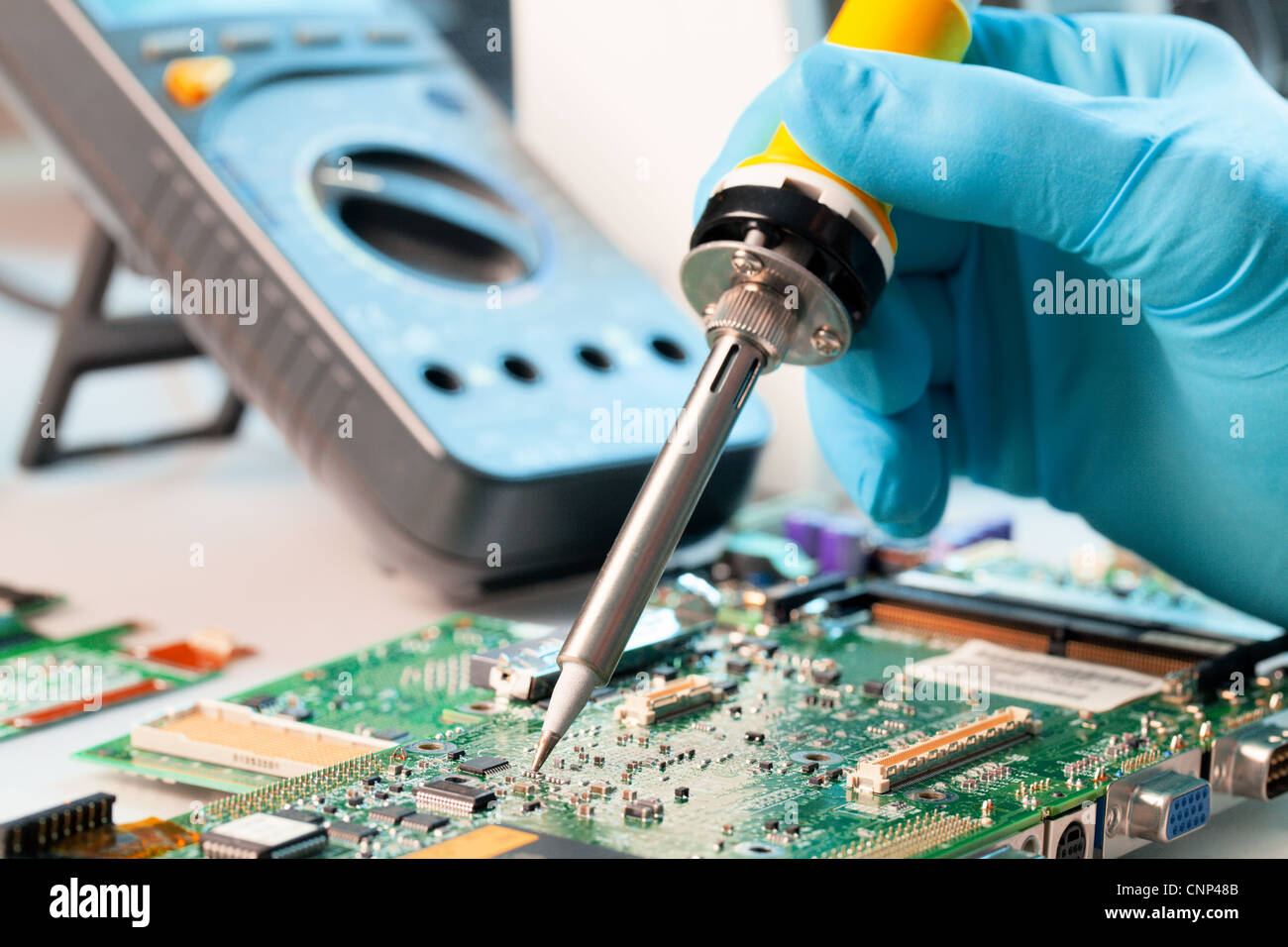 Repaired by soldering a PC board Stock Photo - Alamy