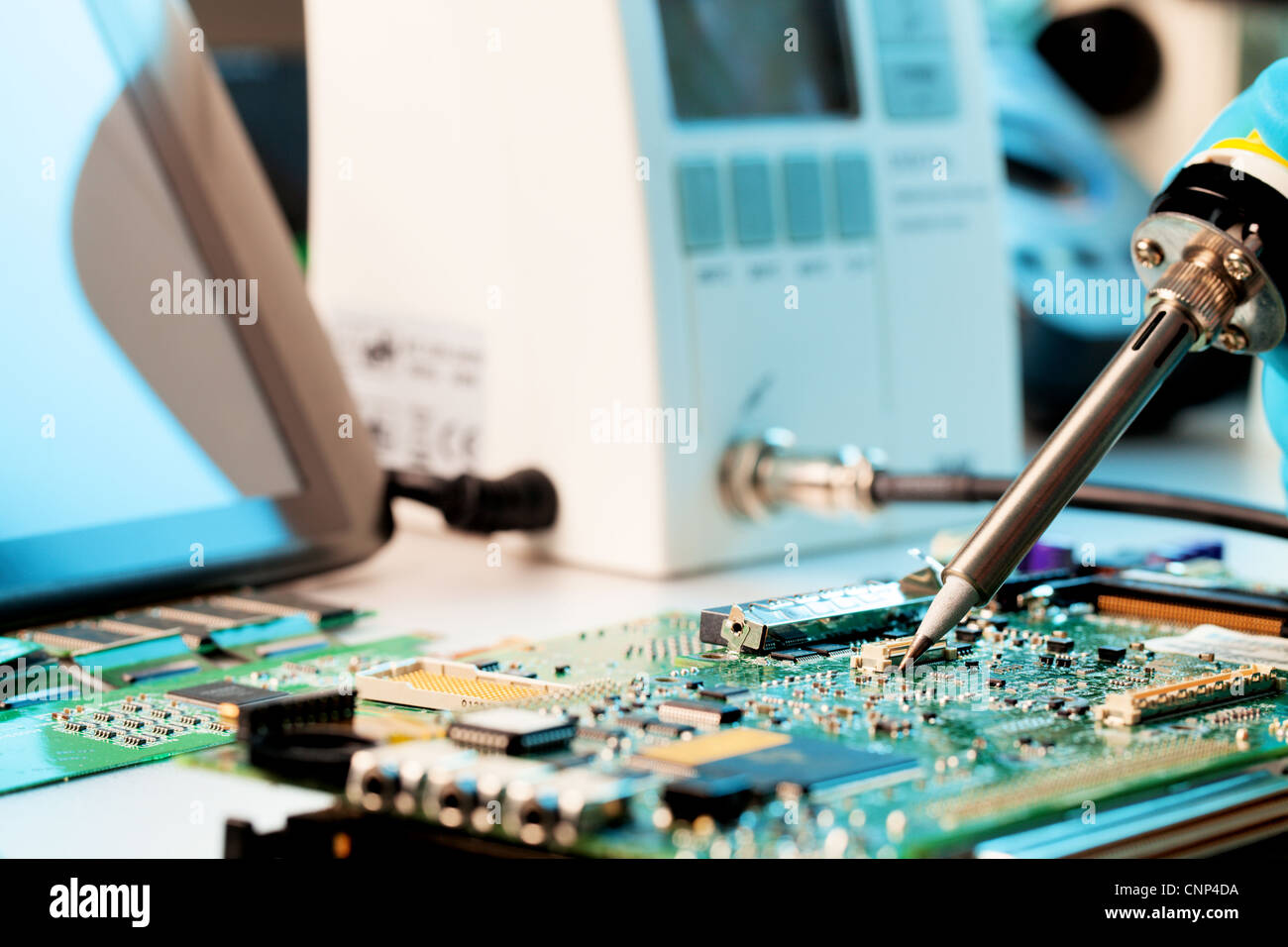 Repaired by soldering a PC board Stock Photo - Alamy