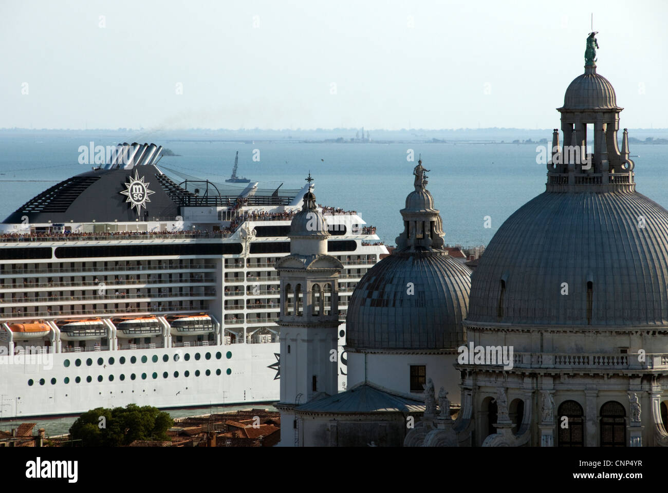 MSC Musica cruise liner passes behind the domed roof of Santa Maria ...