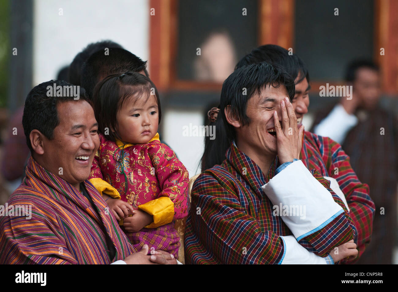 Asia, Bhutan, Bumthang. Audience enjoying performance Domkhar Tshechu ...