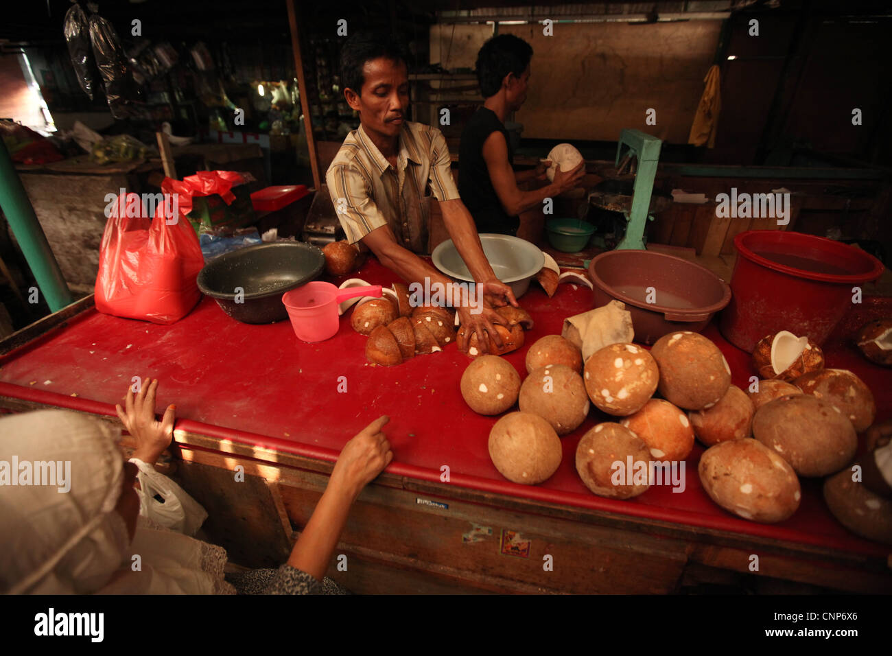 Coconut milk sellers at Pasar Pramuka Market in Jakarta, Indonesia ...