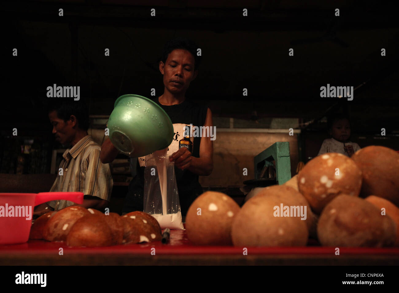 Coconut milk sellers at Pasar Pramuka Market in Jakarta, Indonesia ...
