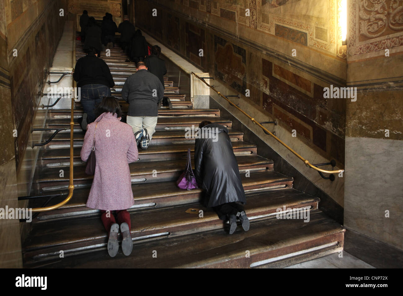 Pilgrims ascend the Scala Sancta in the Lateran Palace in Rome, Italy ...