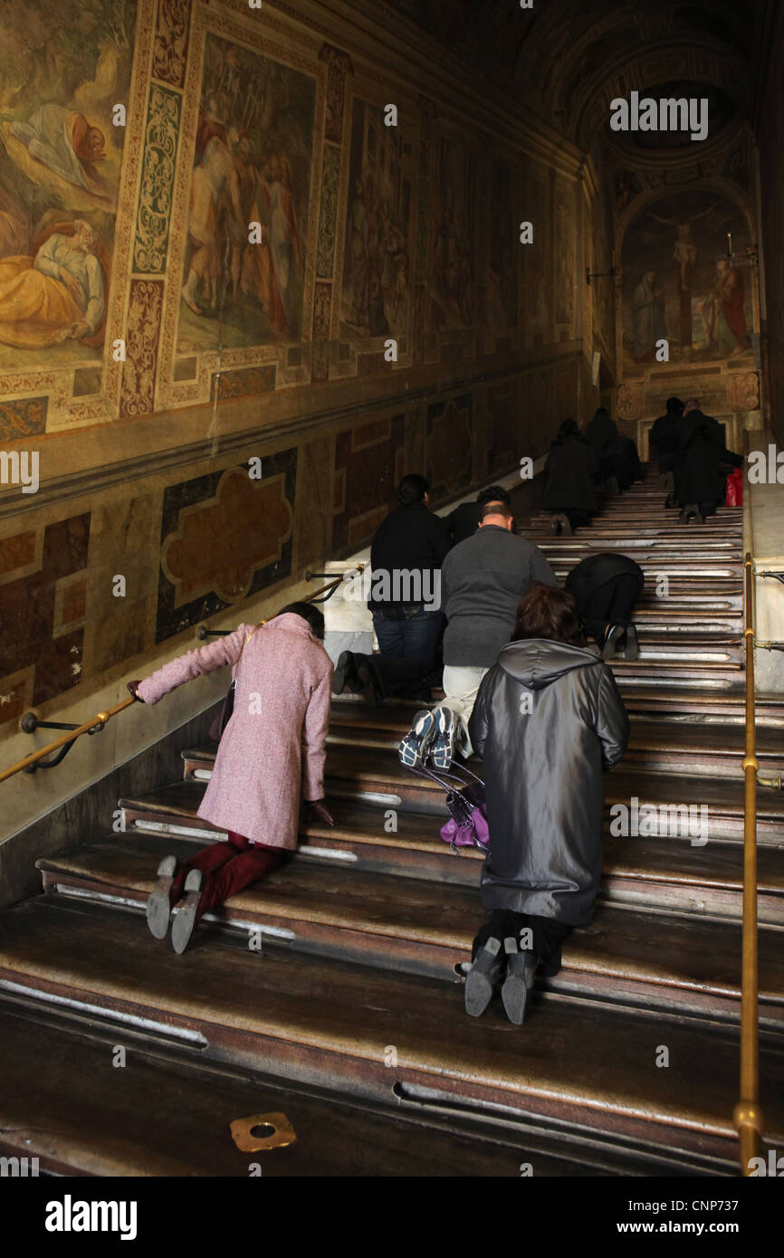 Pilgrims ascend the Scala Sancta in the Lateran Palace in Rome, Italy ...