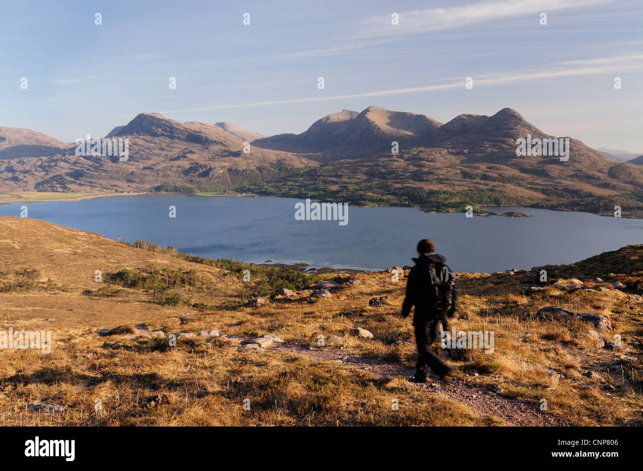 Walker descending the lower slopes of Beinn Alligin towards Loch ...