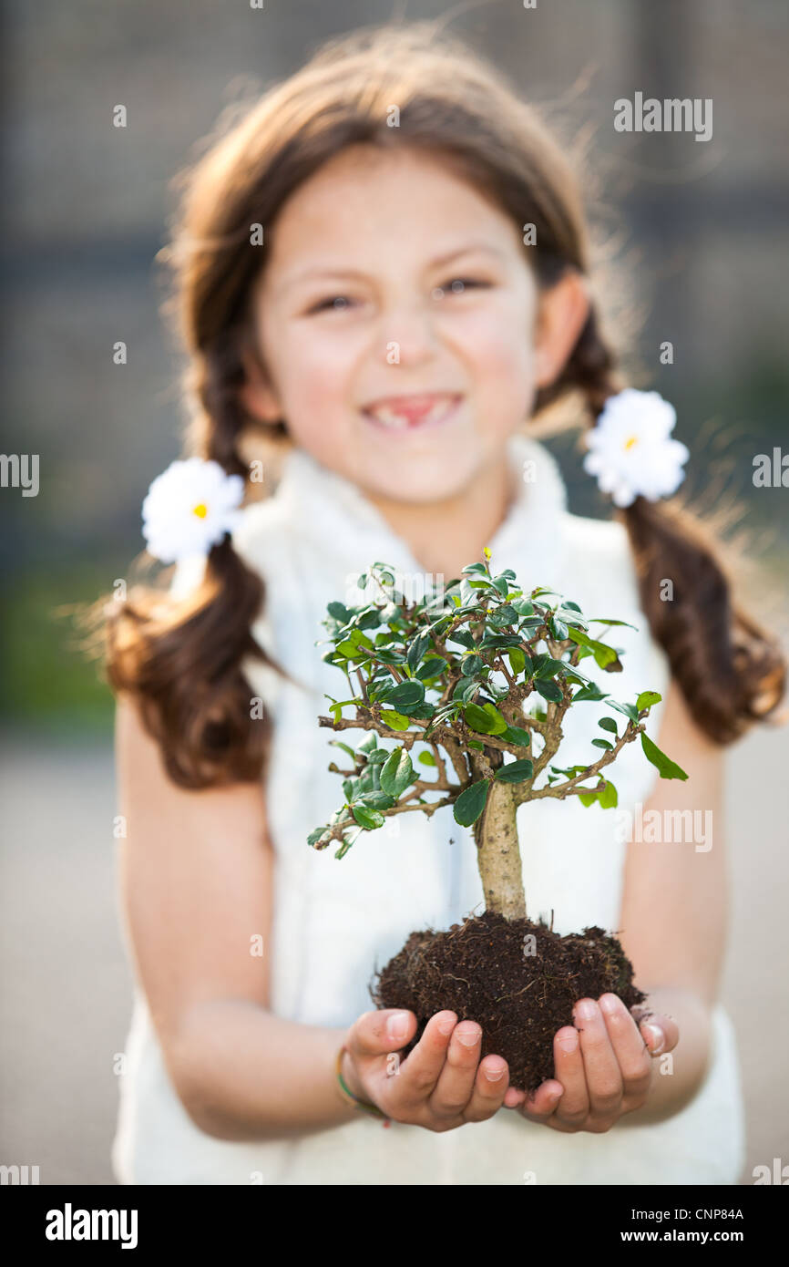 child caring for the environment (focus on tree Stock Photo - Alamy