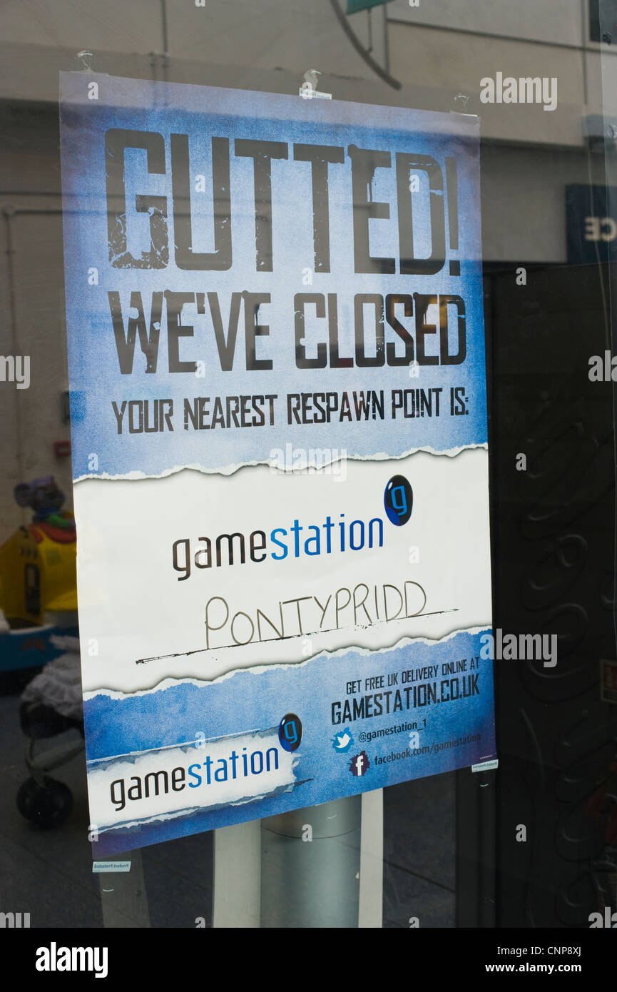 Closed sign in shop window of gamestation in Merthyr Tydfil South Wales ...