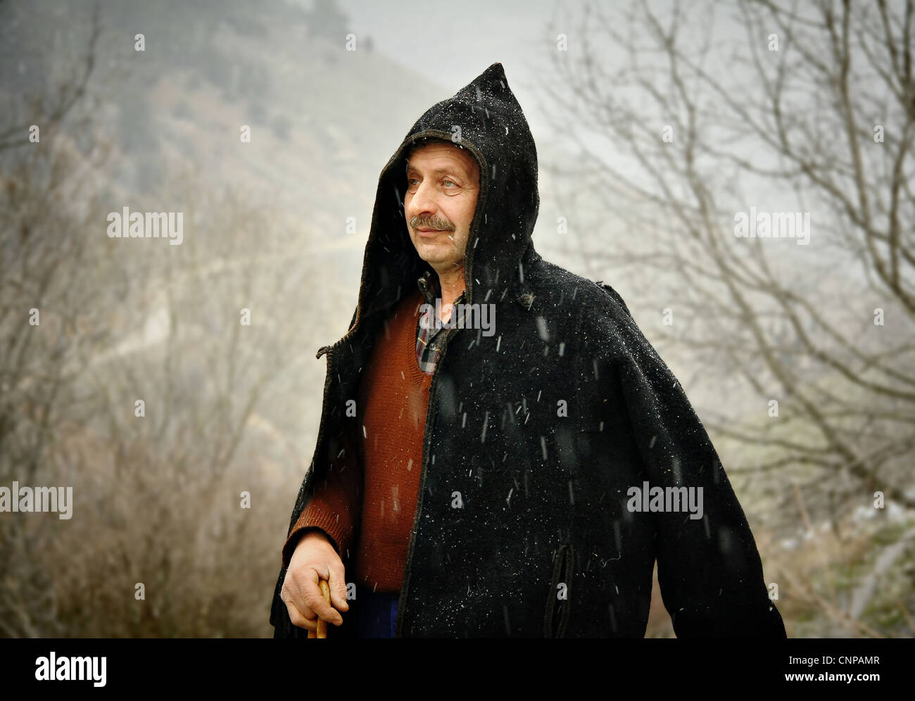 Old shepherd with his woolen black coat Stock Photo - Alamy