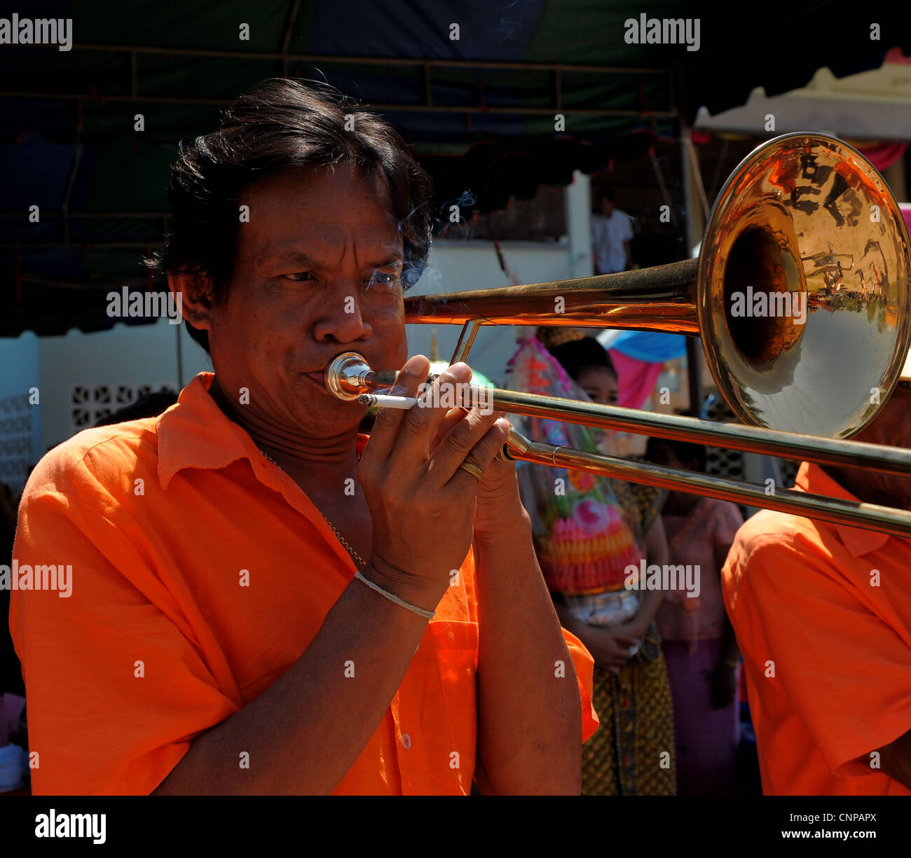 trombone player at ordination of monk ceremony, pong pang temple,bank ...