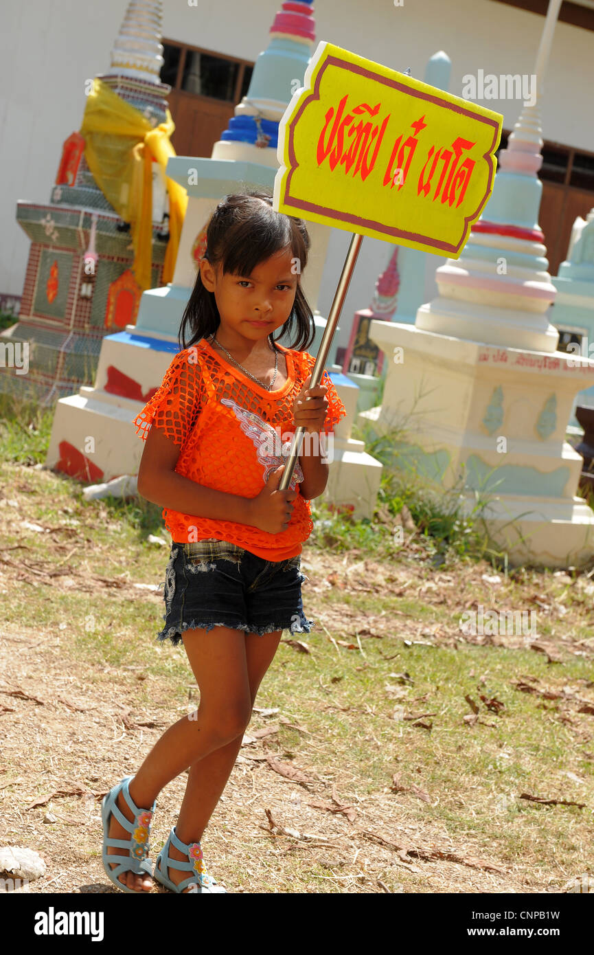 young girl helper during monk ordination ceremony,wat pong pang, samut ...
