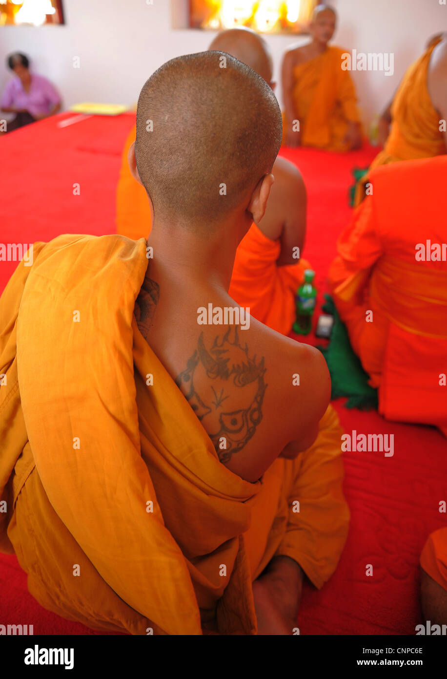 monk with devil tattoo , monk ordination ceremony ,wat pong pang ...