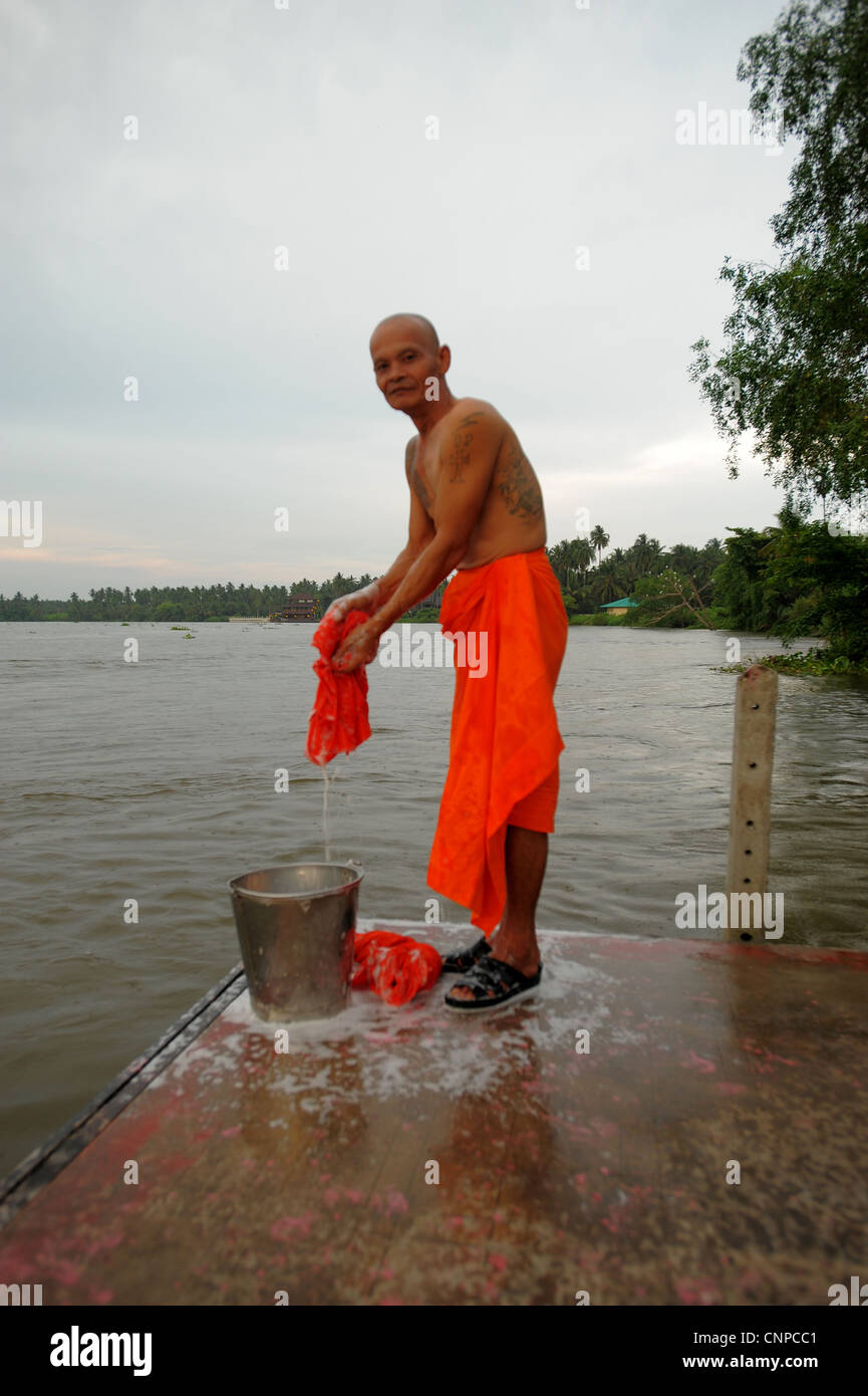 monk washing his clothes , Mae Klong River , Amphawa, Samut Sakhon ...