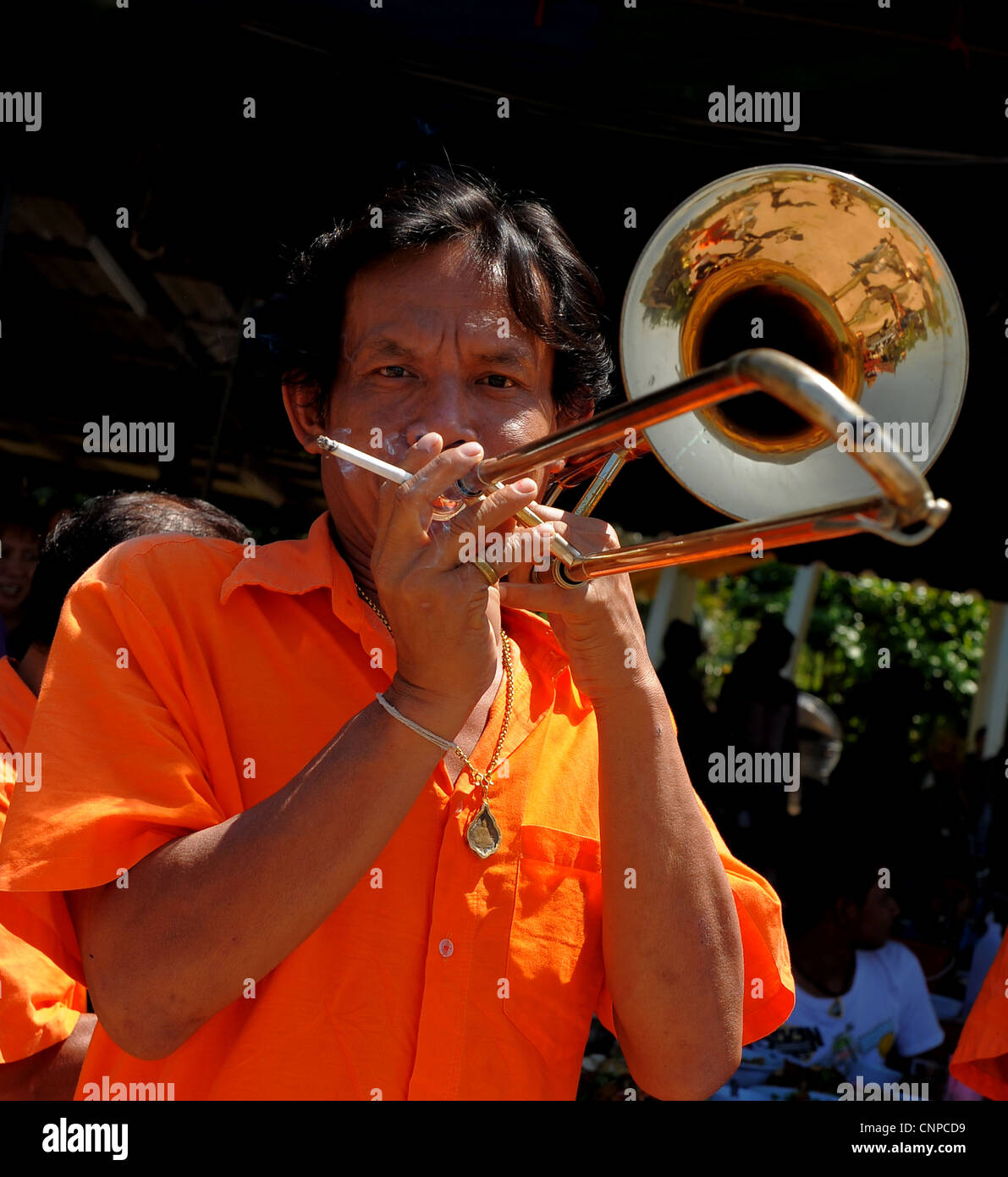 trombone player at ordination of monk ceremony, pong pang temple,bank ...