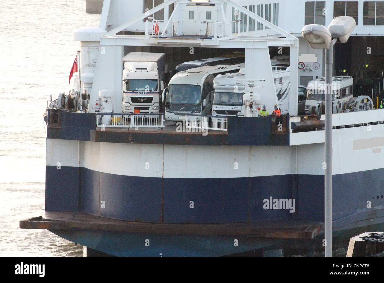 Ferry entering port loaded with vehicles Stock Photo - Alamy