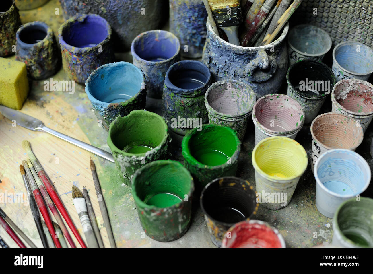 The painter's tools, colors and brushes, in a workshop Stock Photo - Alamy