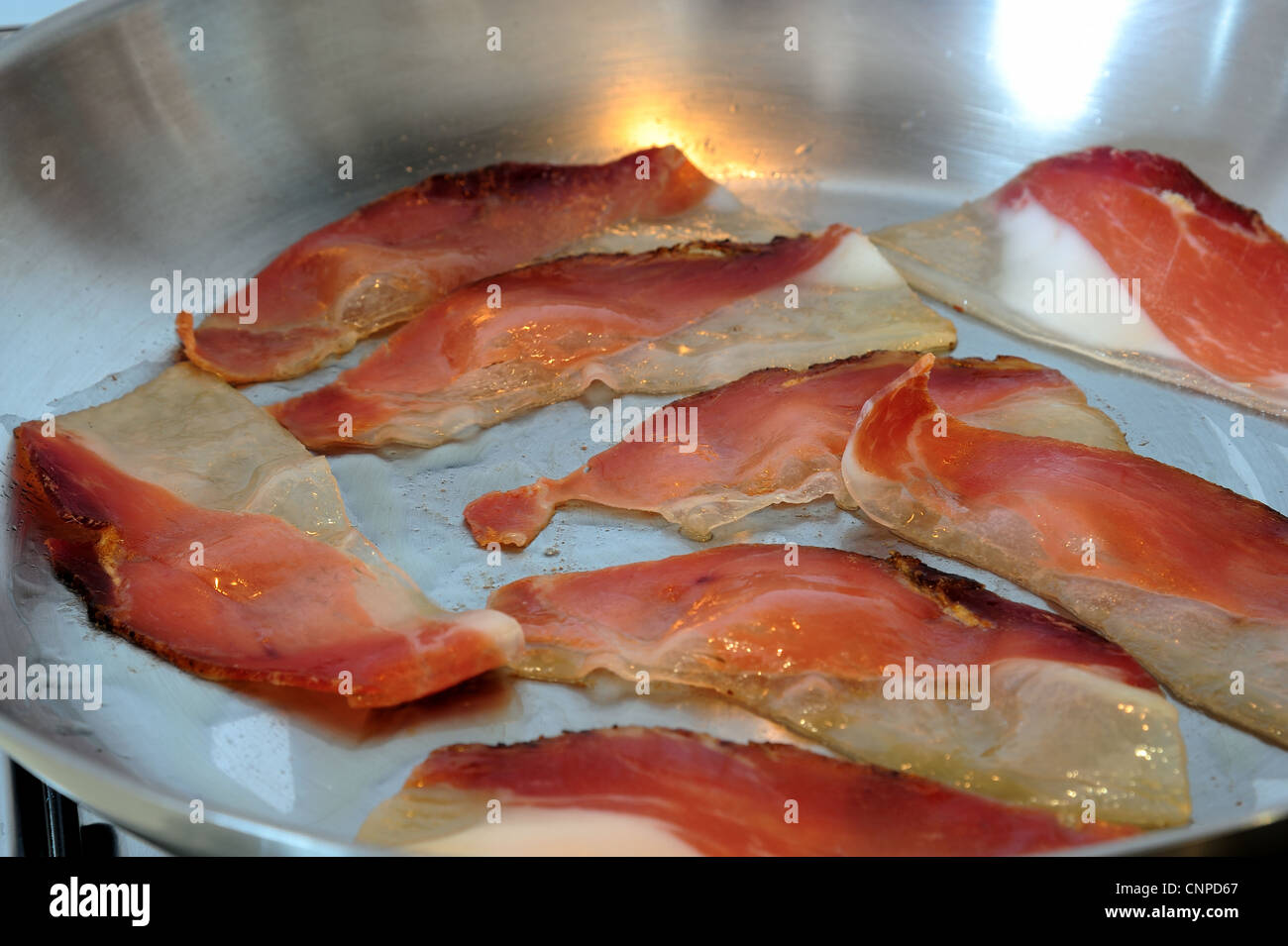 A close up of some slices of roasted speck Stock Photo - Alamy