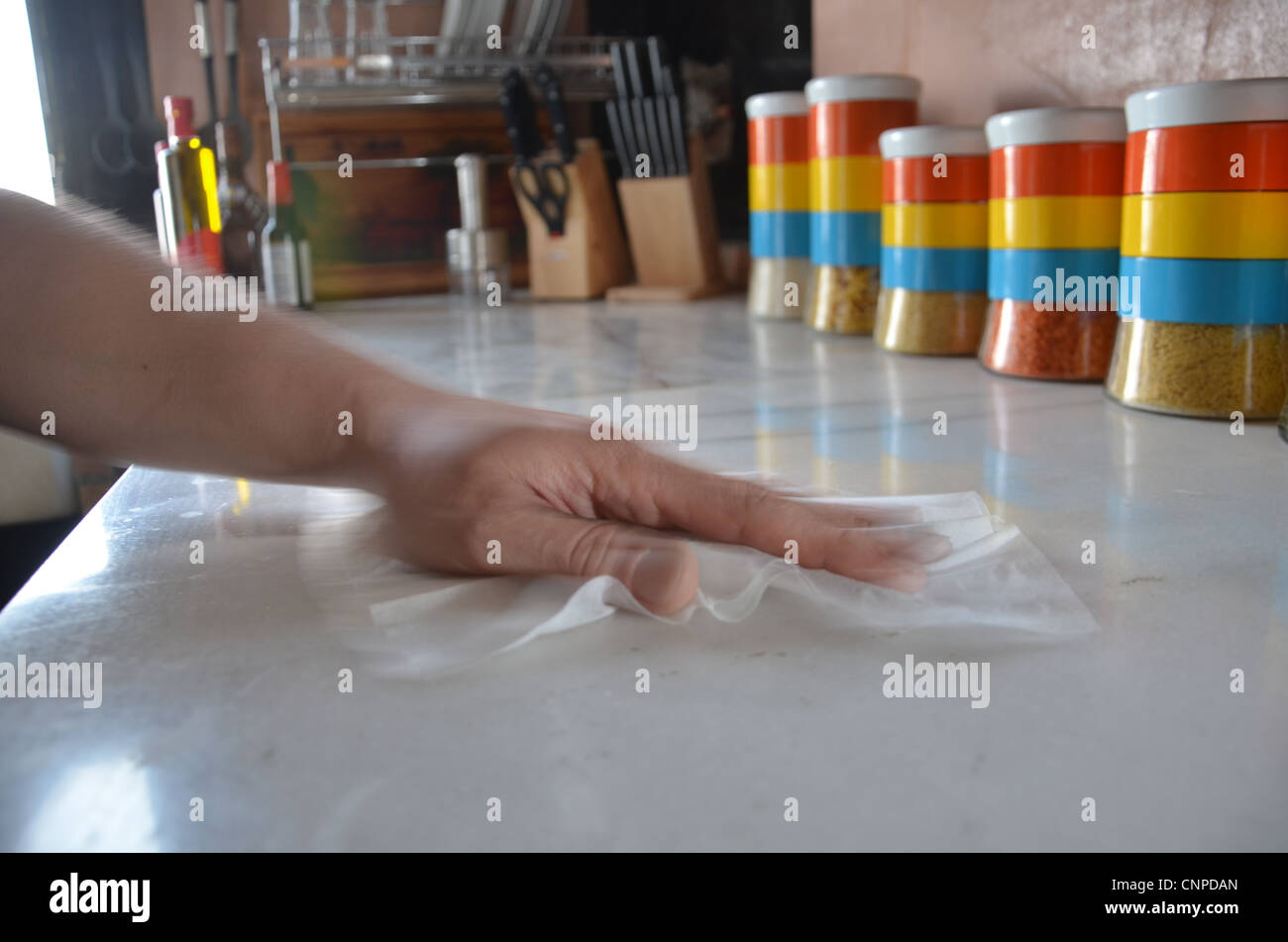 Hand in motion wiping kitchen counter Stock Photo - Alamy