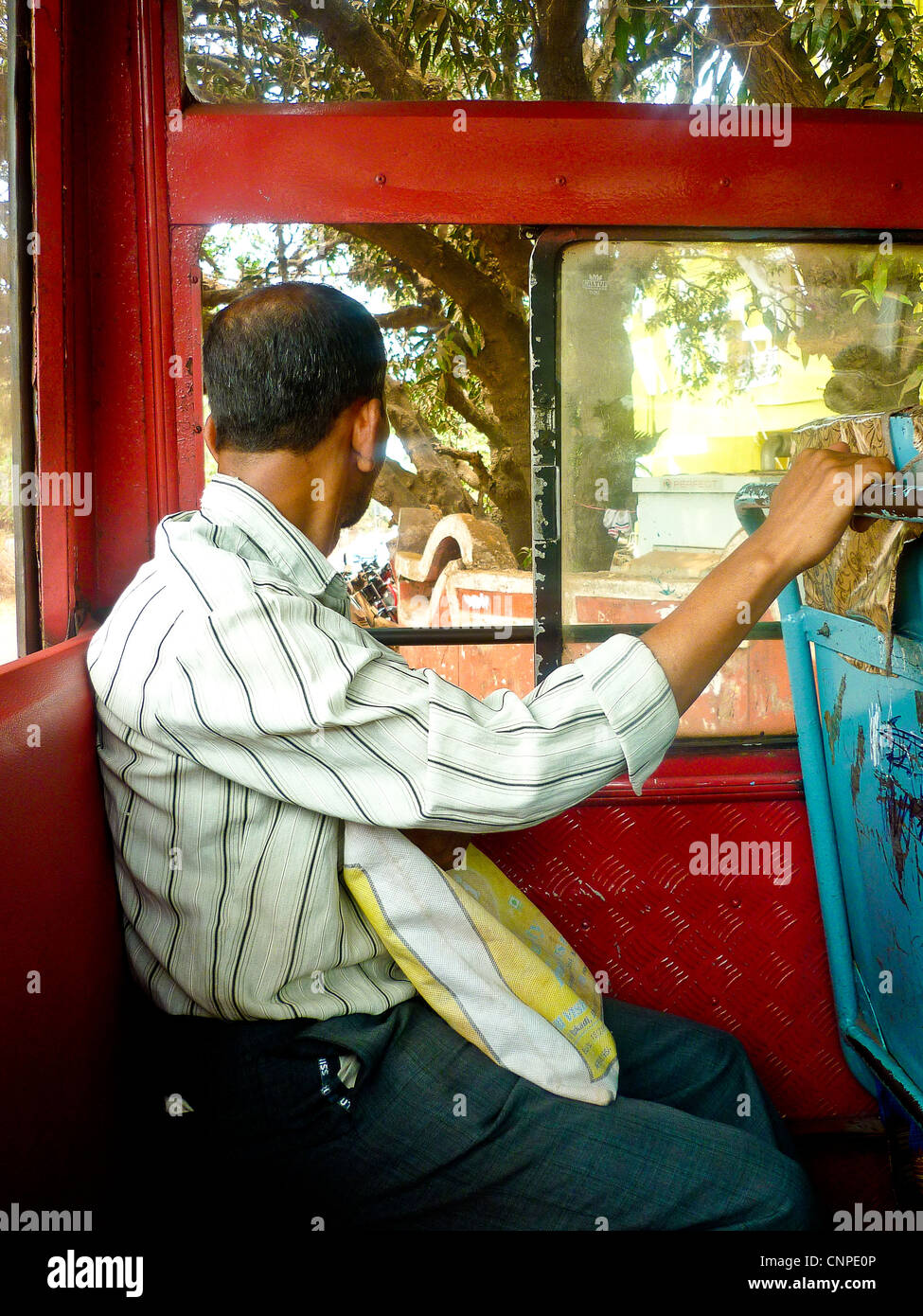 man on bus, Goa, India Stock Photo - Alamy