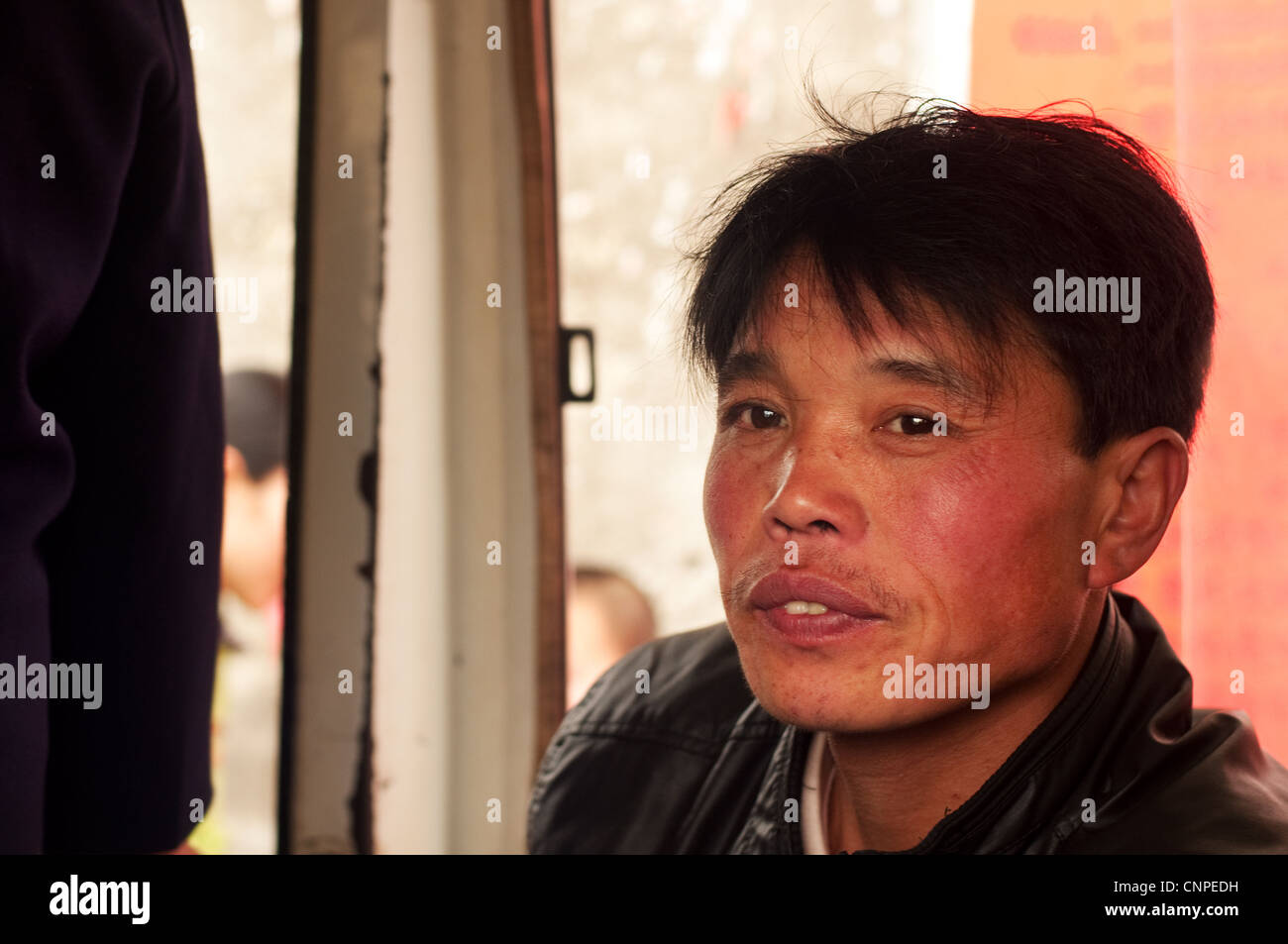 Candid portrait of a mustached Chinese man on a public bus, Southern ...