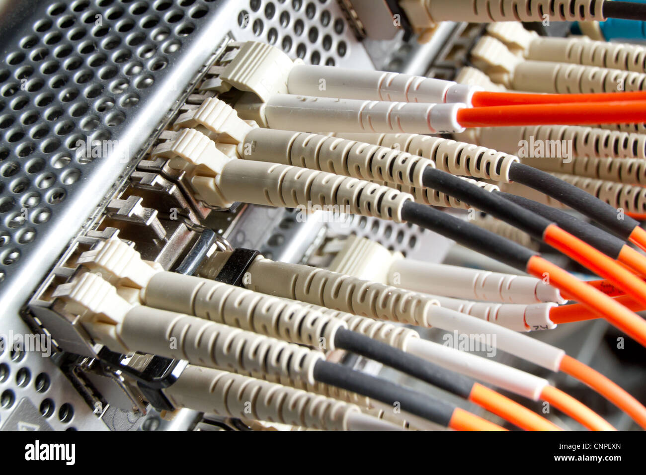 optic fiber cables connected to hub Stock Photo - Alamy