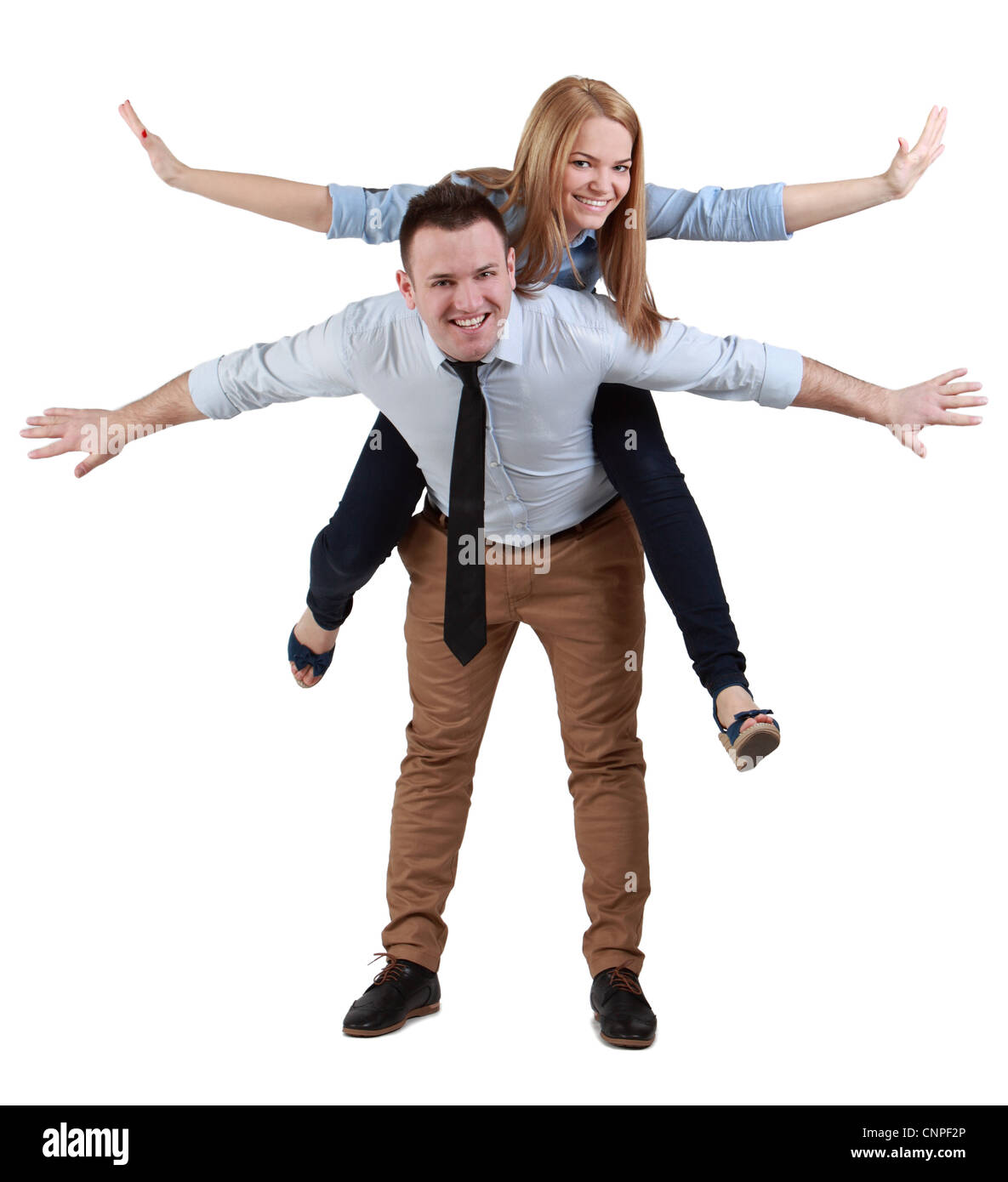 Image of a young couple having fun together against a white background ...