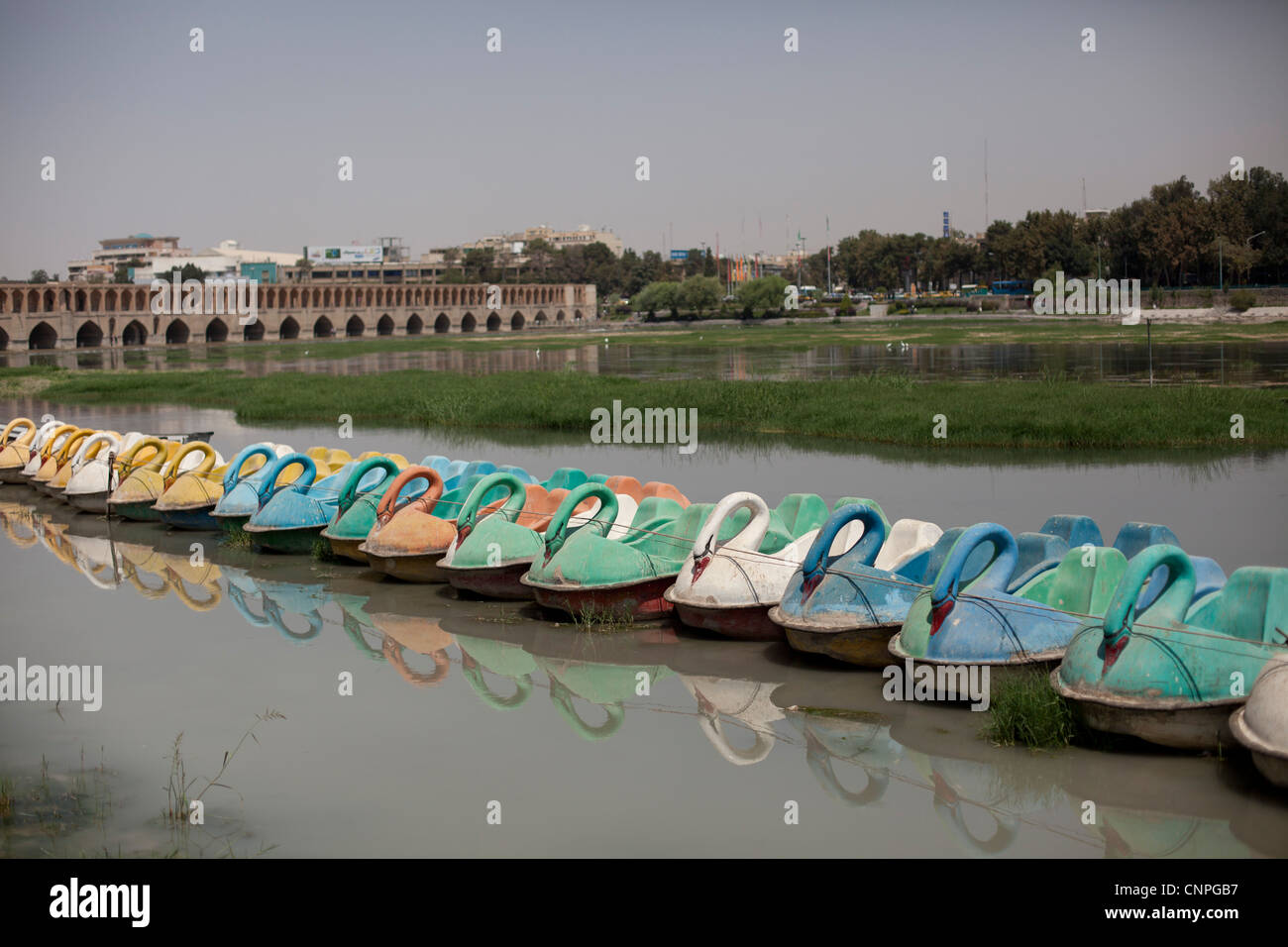 pedalos line the bank of the Zayanderud river in Esfahan Stock Photo ...