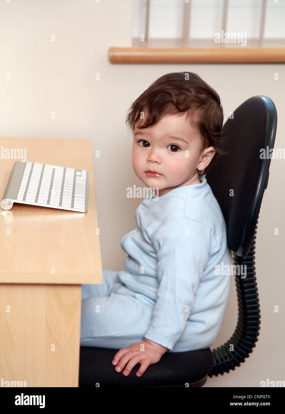 Baby sat on office chair Stock Photo - Alamy
