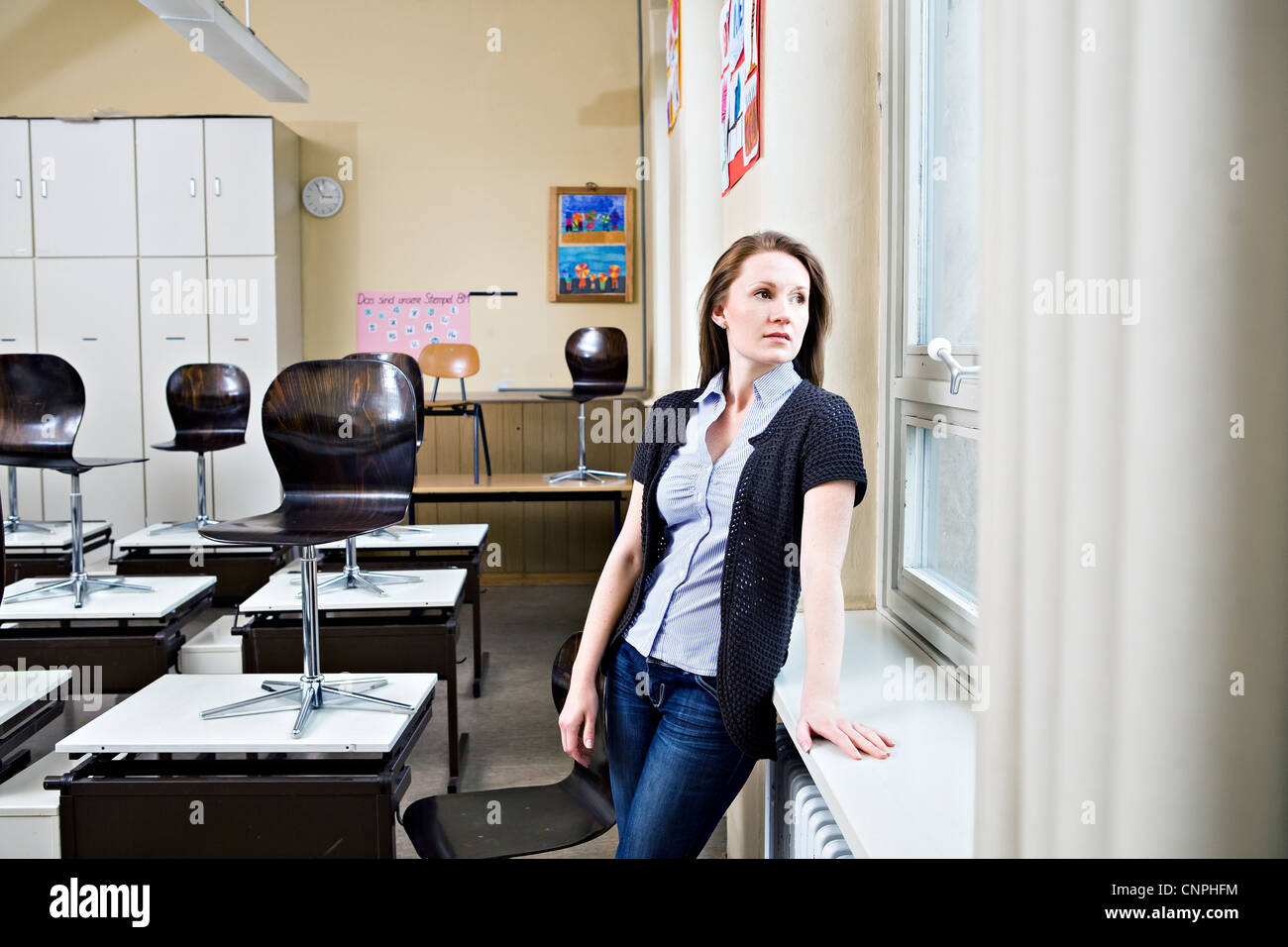 portrait of a young female teacher in the classroom Stock Photo - Alamy