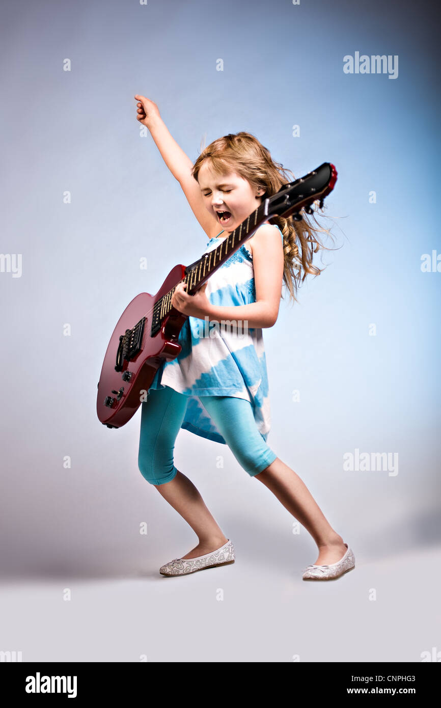 portrait of young girl with a guitar on the stage Stock Photo - Alamy