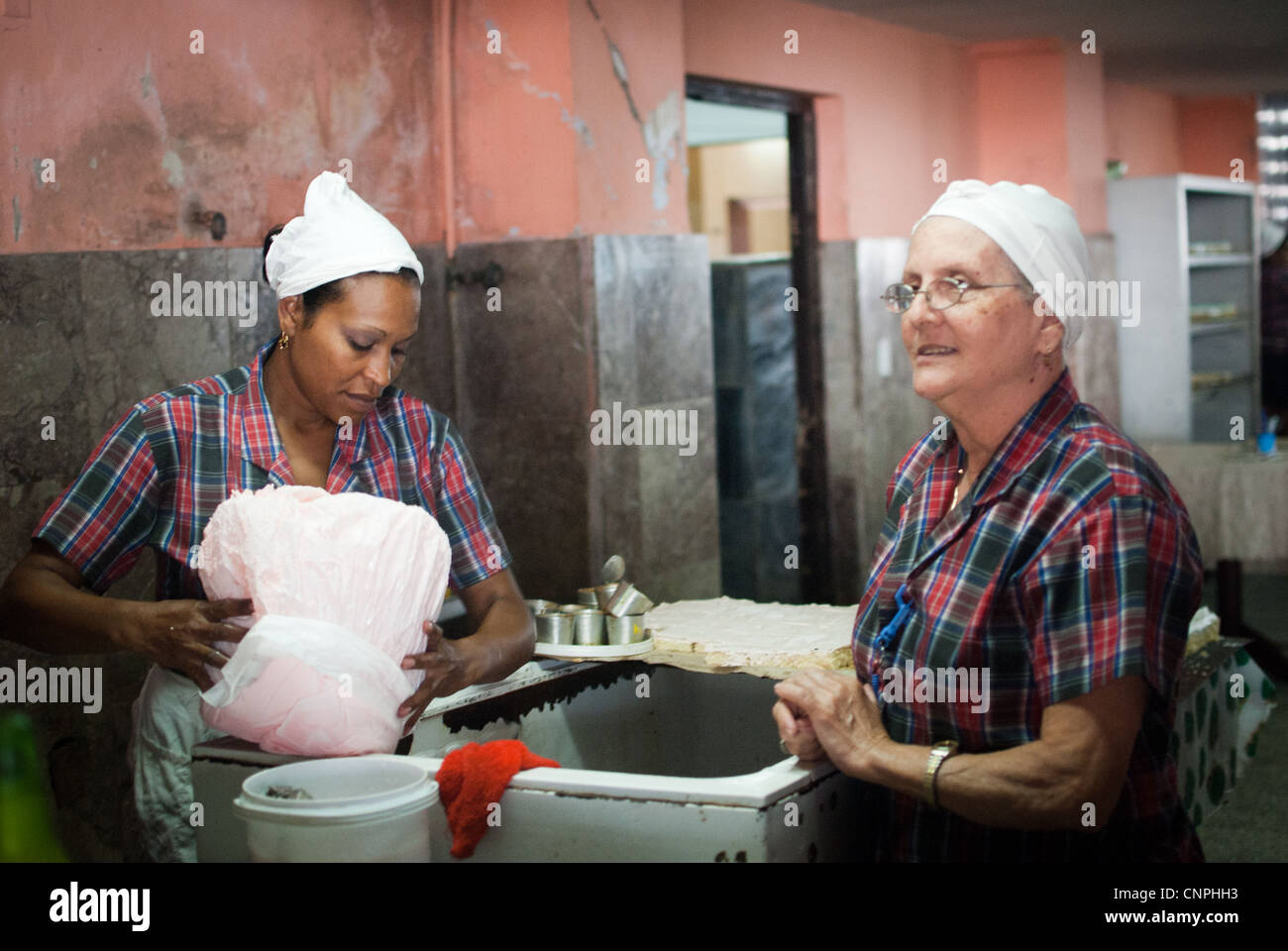 Two Cuban women working serving ice cream in Coppelia, Santa Clara ...