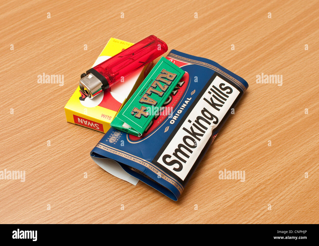 Rolling tobacco green rizla filters and lighter Stock Photo - Alamy Rolling tobacco green rizla filters and lighter Stock Photo - Alamy