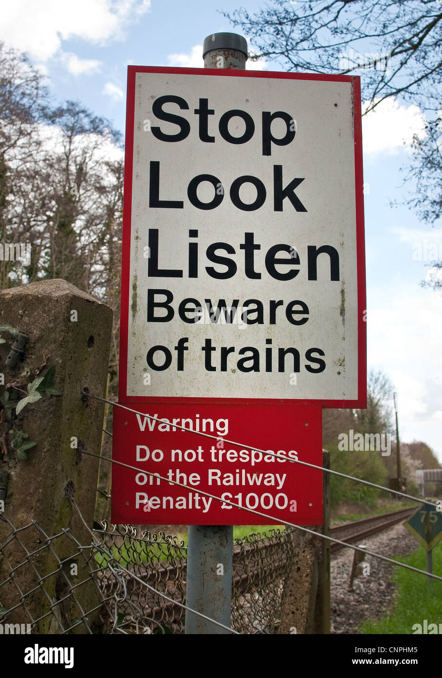 STOP LOOK LISTEN Beware of trains sign Stock Photo - Alamy