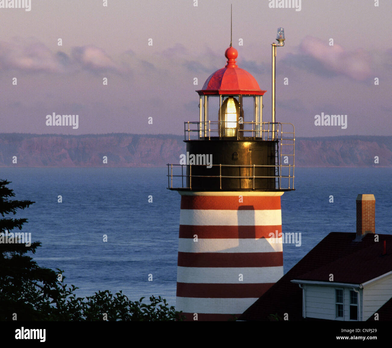West Quoddy Head Light at dusk, Quoddy State Park, Lubec, Maine, USA ...