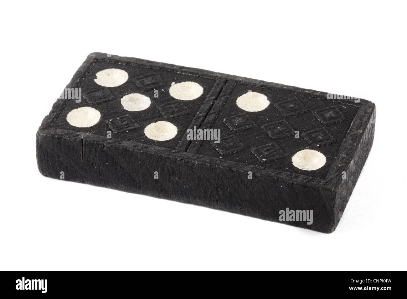 Single old domino on a white background Stock Photo - Alamy