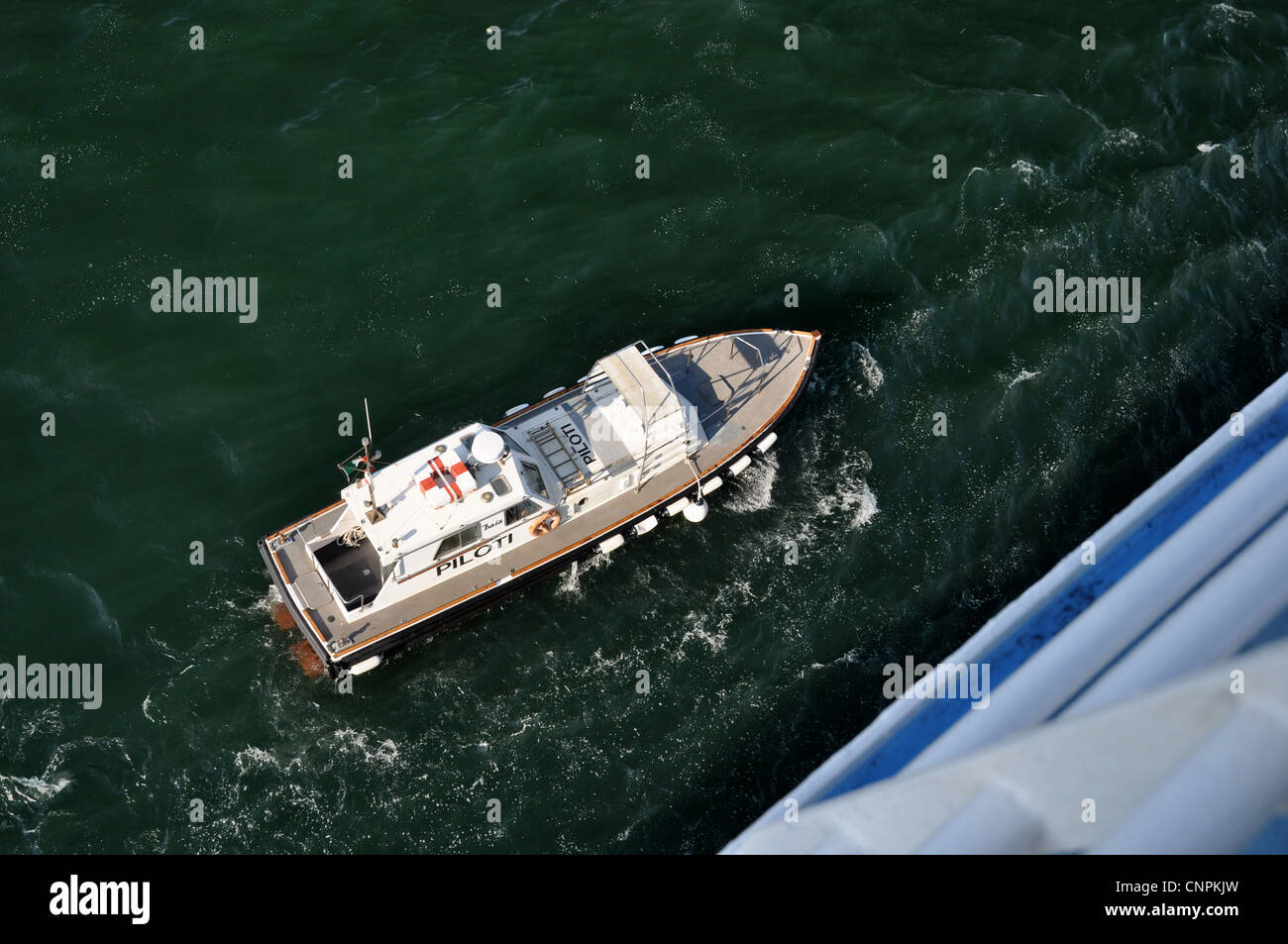 View from above of sea pilot boat guiding cruise ship Stock Photo - Alamy