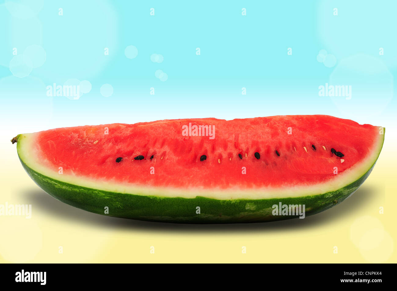 Watermelon slice on colorful summer background Stock Photo - Alamy