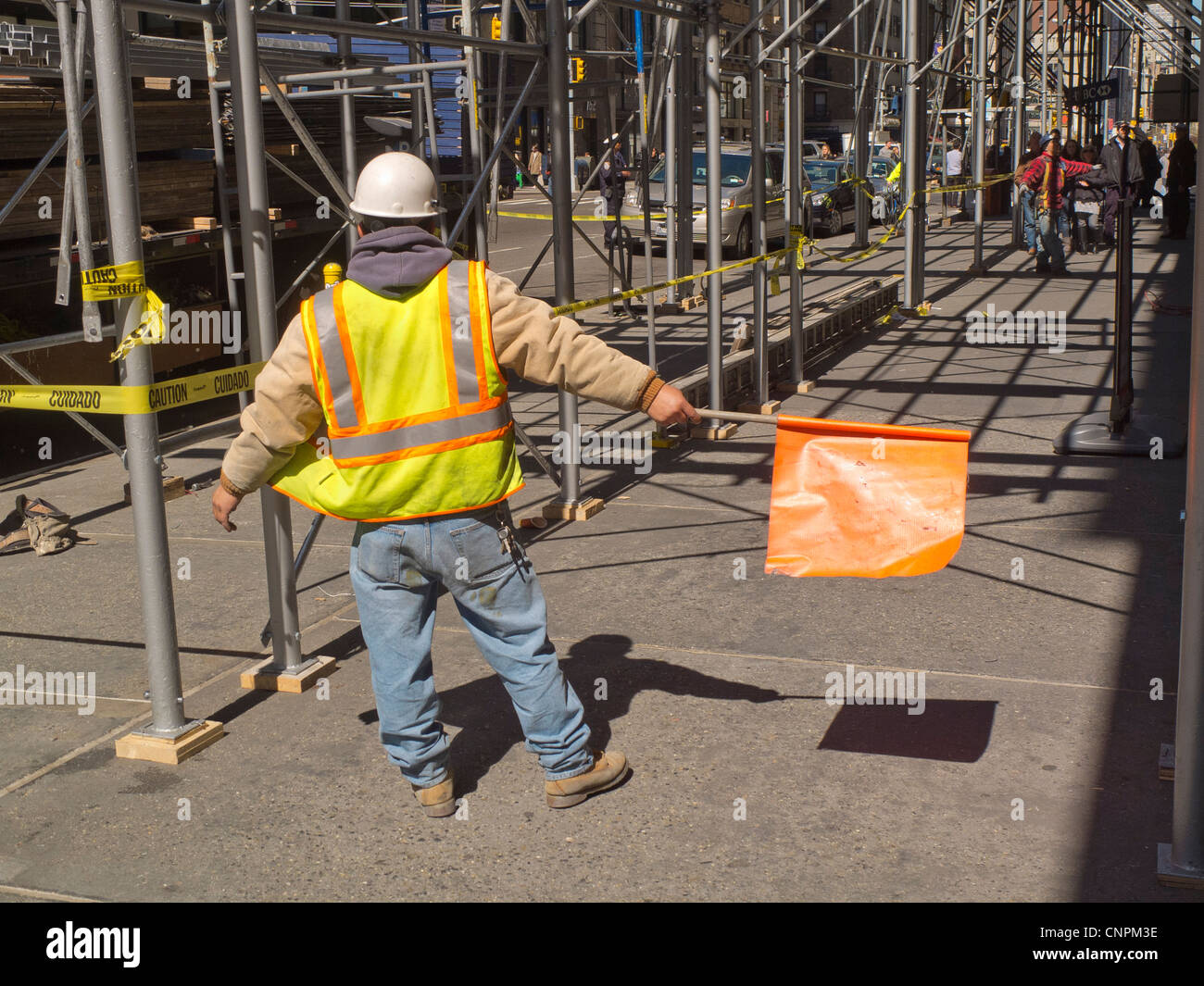 construction workers on scaffolding on an apartment building in ...