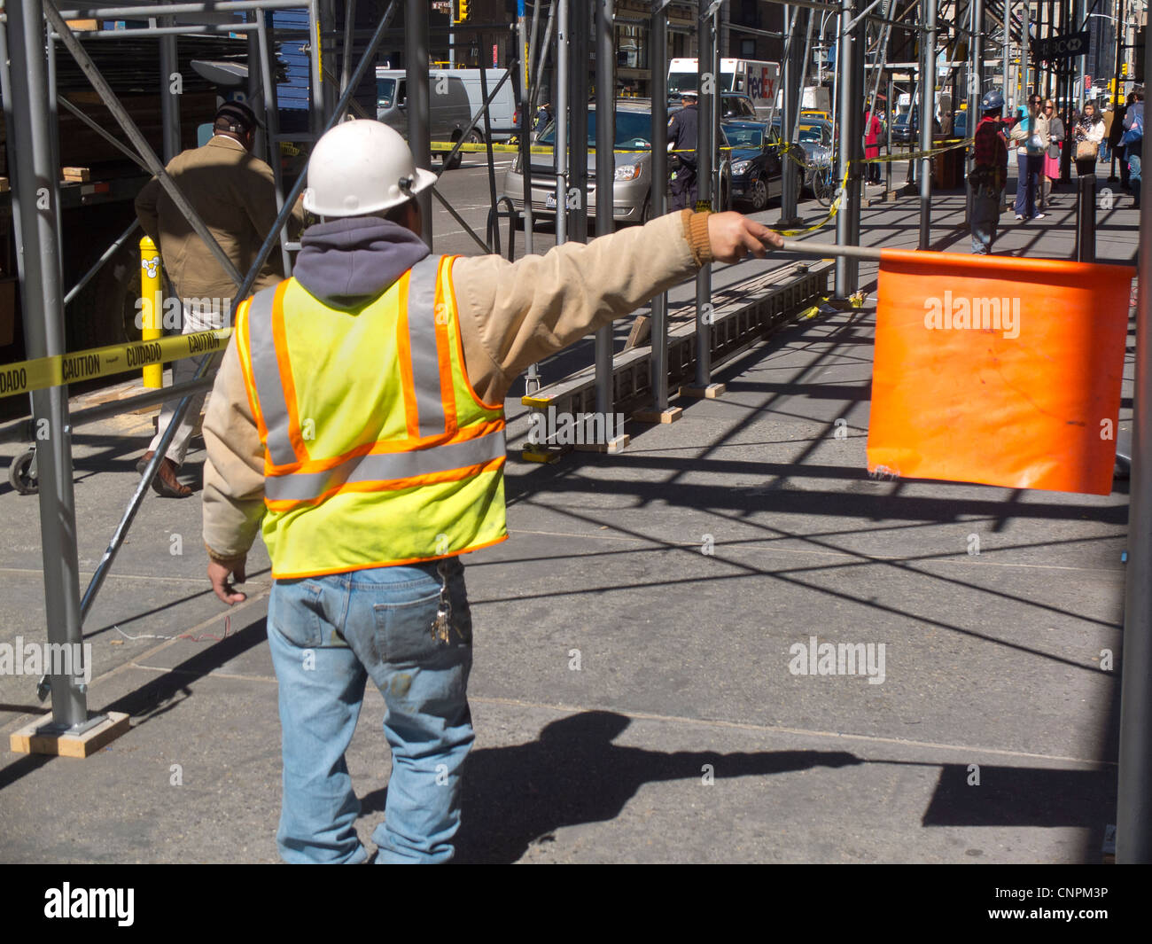 construction workers on scaffolding on an apartment building in ...