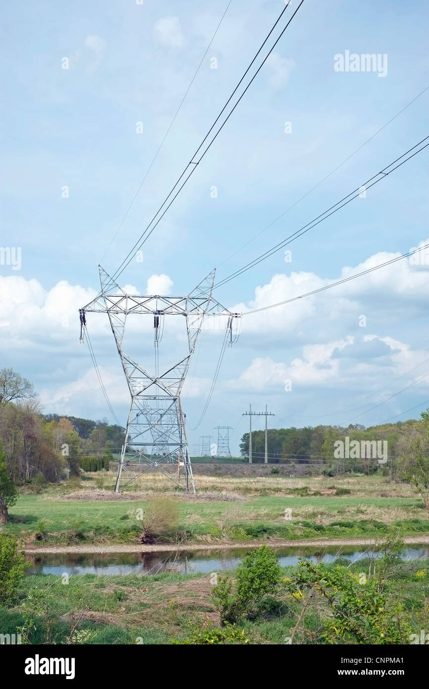 Overhead power lines and stream Stock Photo - Alamy