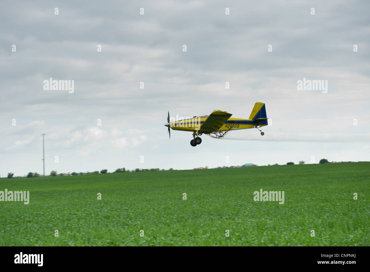 Crop duster spraying wheat field in central Oklahoma Stock Photo - Alamy
