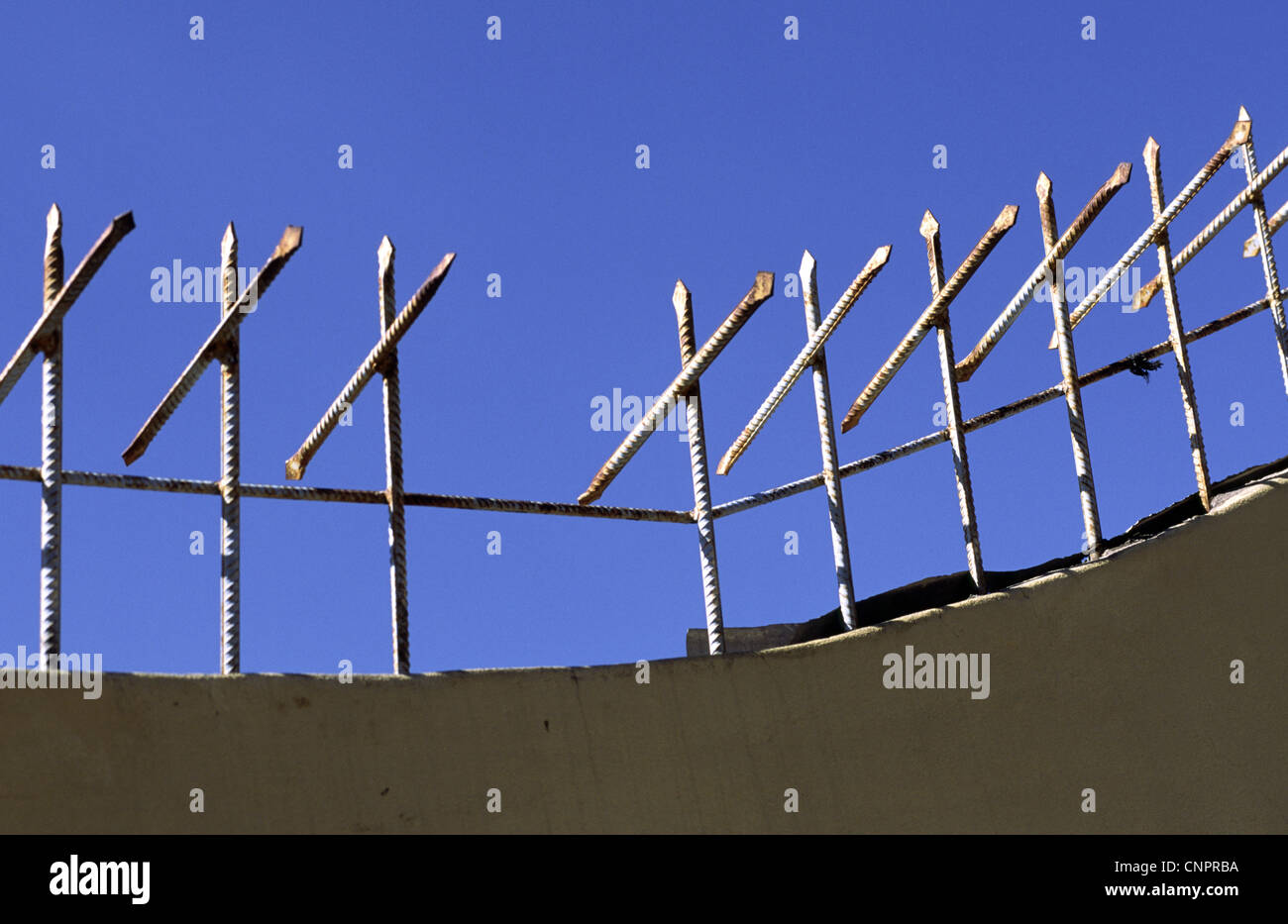 Sharpened rebar as a deterrent for intruders on top of wall. Cuzco ...