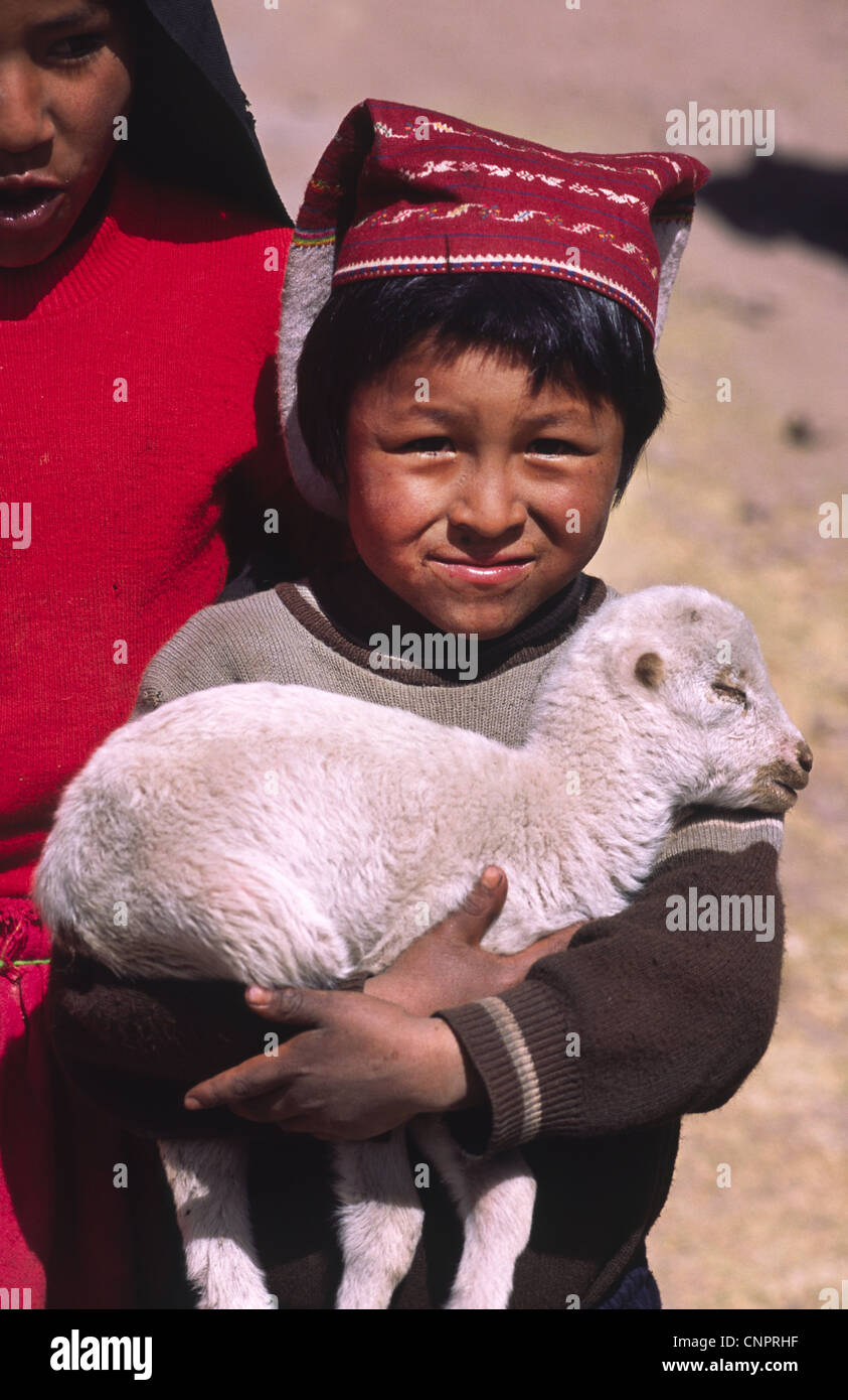 Boy with traditional knitted cap on Taquile Island. Lake Titicaca, Peru ...