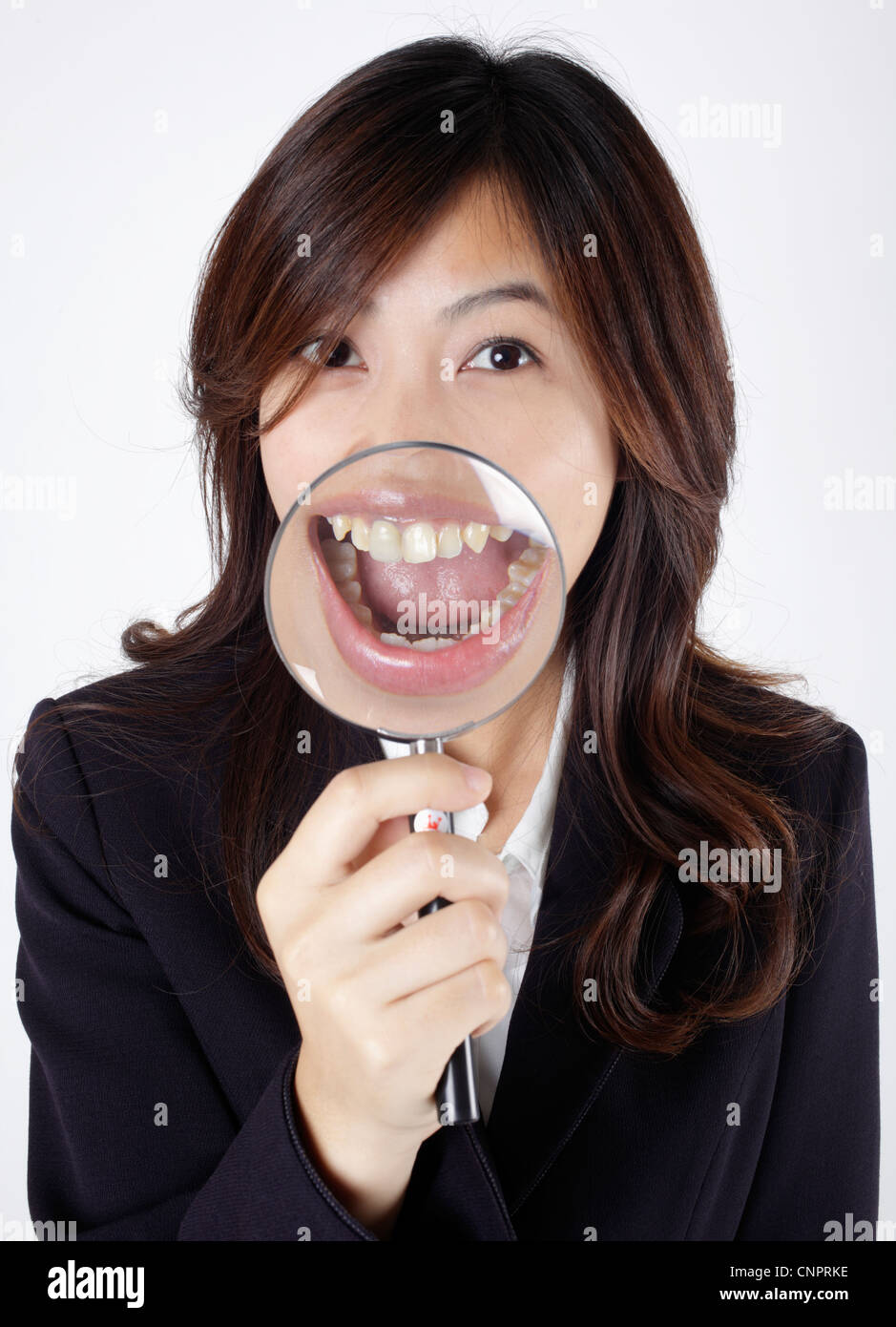 Office lady plays magnifier Stock Photo - Alamy