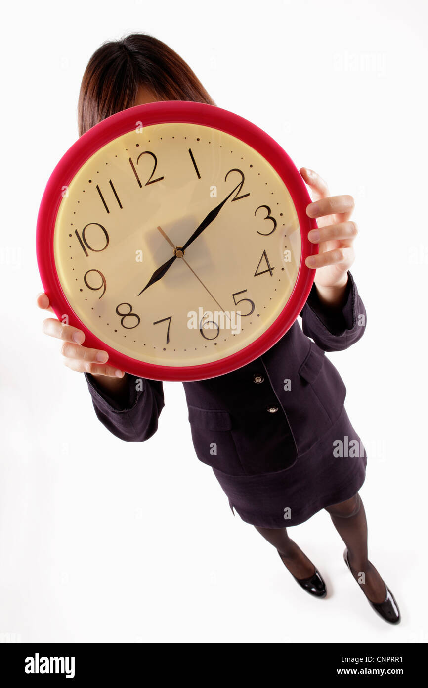 Office lady plays clock Stock Photo - Alamy