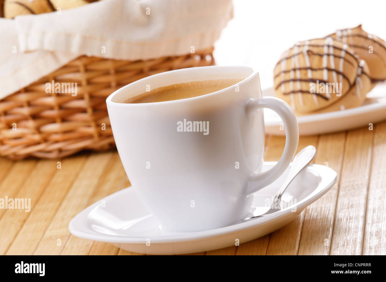 Coffee cup with basket of cookie sandwiches Stock Photo - Alamy