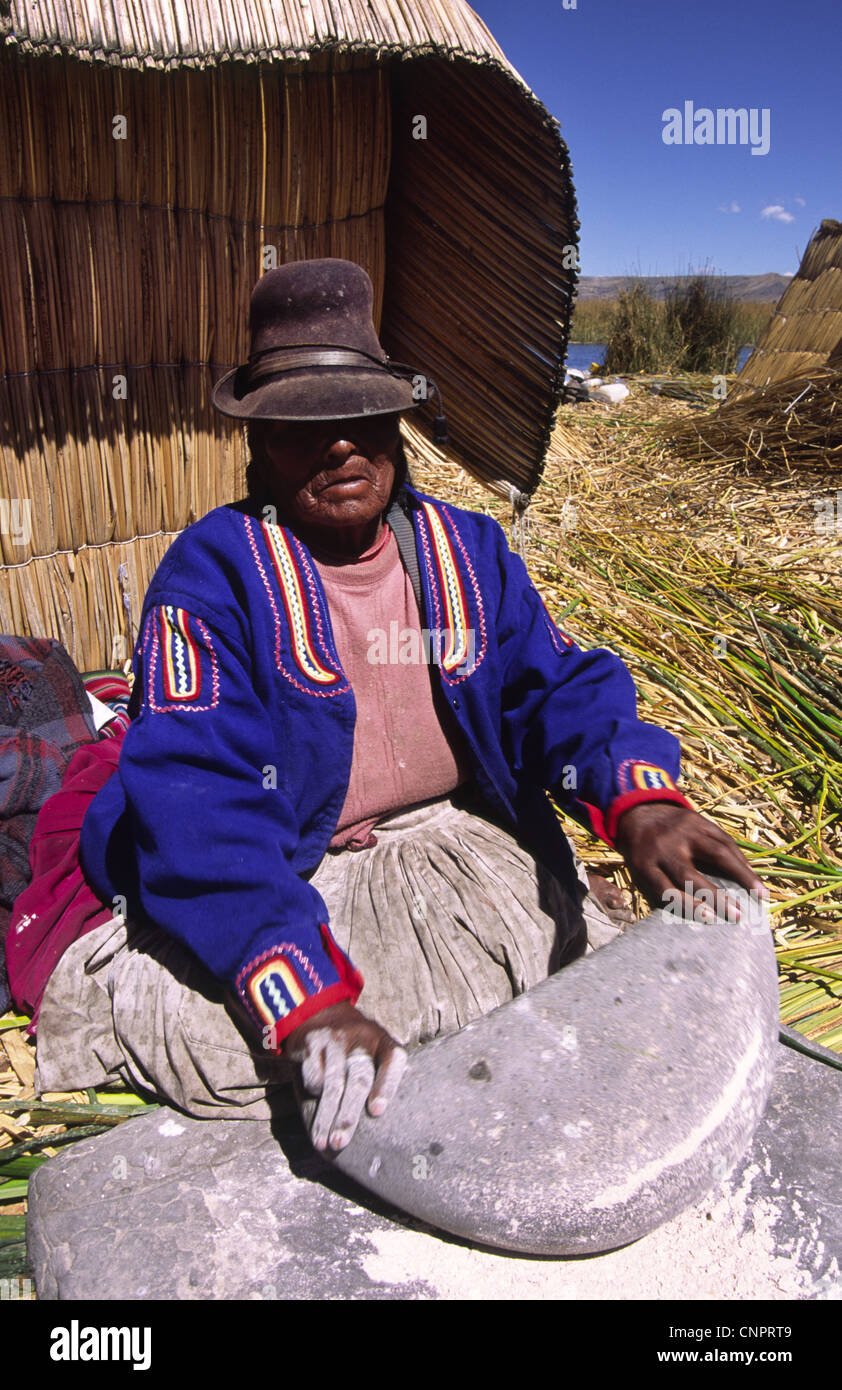 Uros woman on floating reed Island. Lake Titicaca, Peru Stock Photo - Alamy