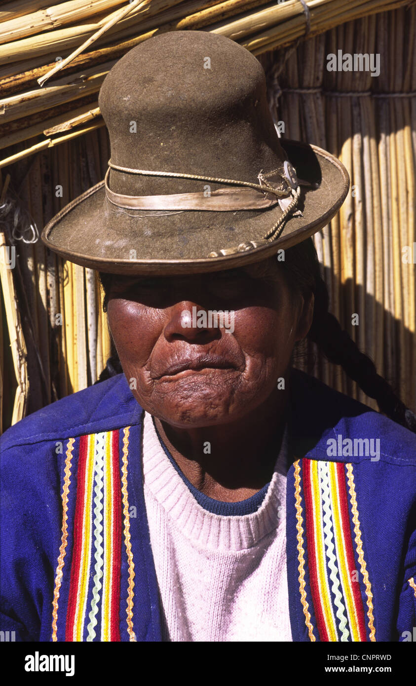 Uros woman on floating reed Island. Lake Titicaca, Peru Stock Photo - Alamy