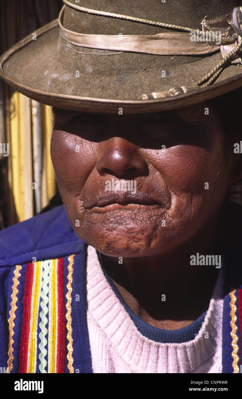 Uros woman on floating reed Island. Lake Titicaca, Peru Stock Photo - Alamy