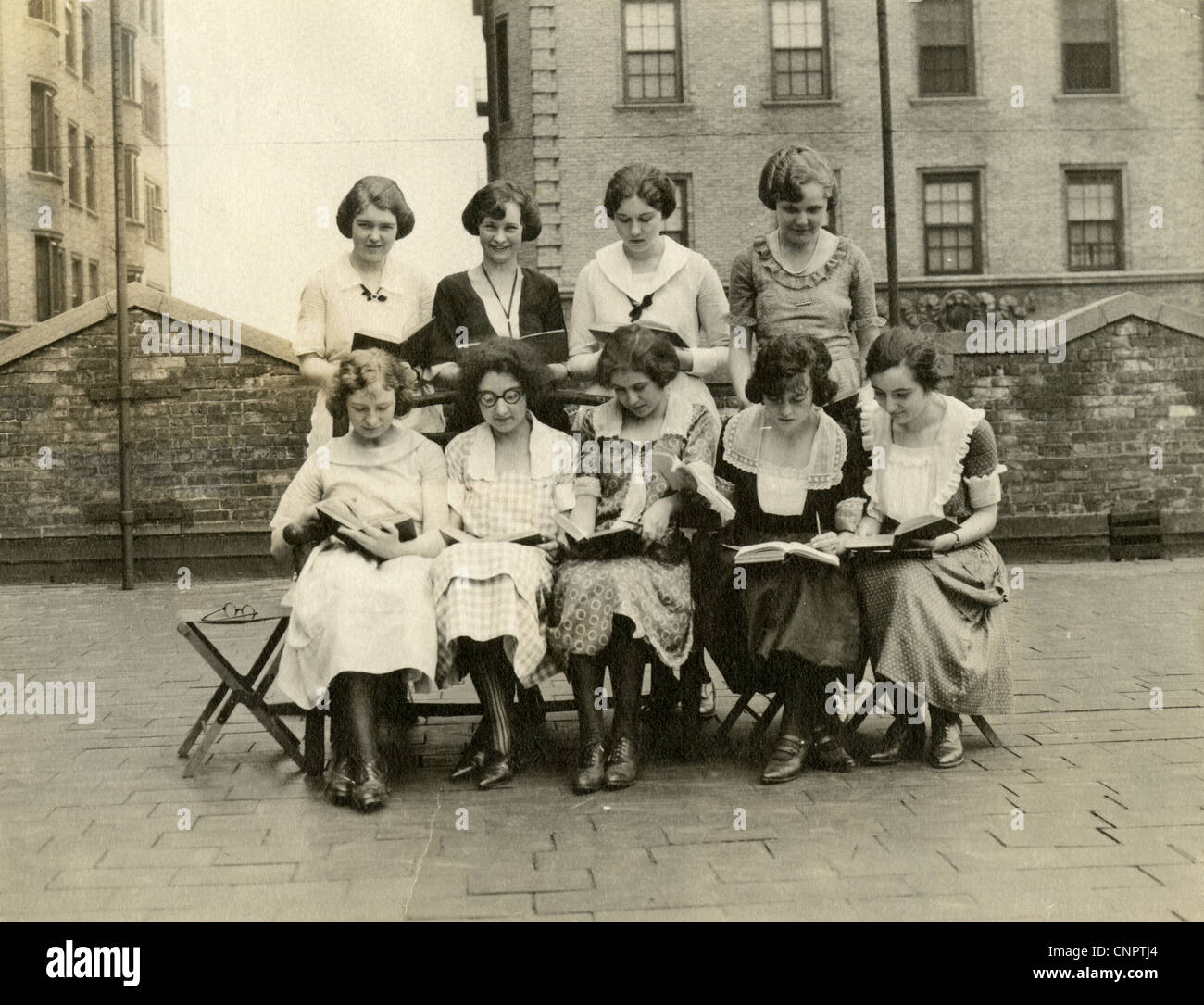 Circa 1930s photograph of a group of girls reading at a New England ...