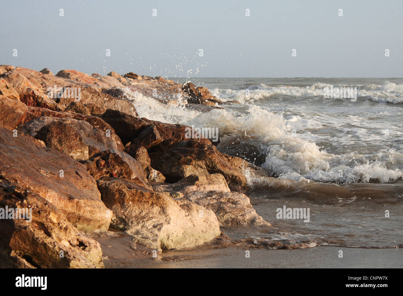 The first photo of a sequence of a wave that shatters on the reef ...